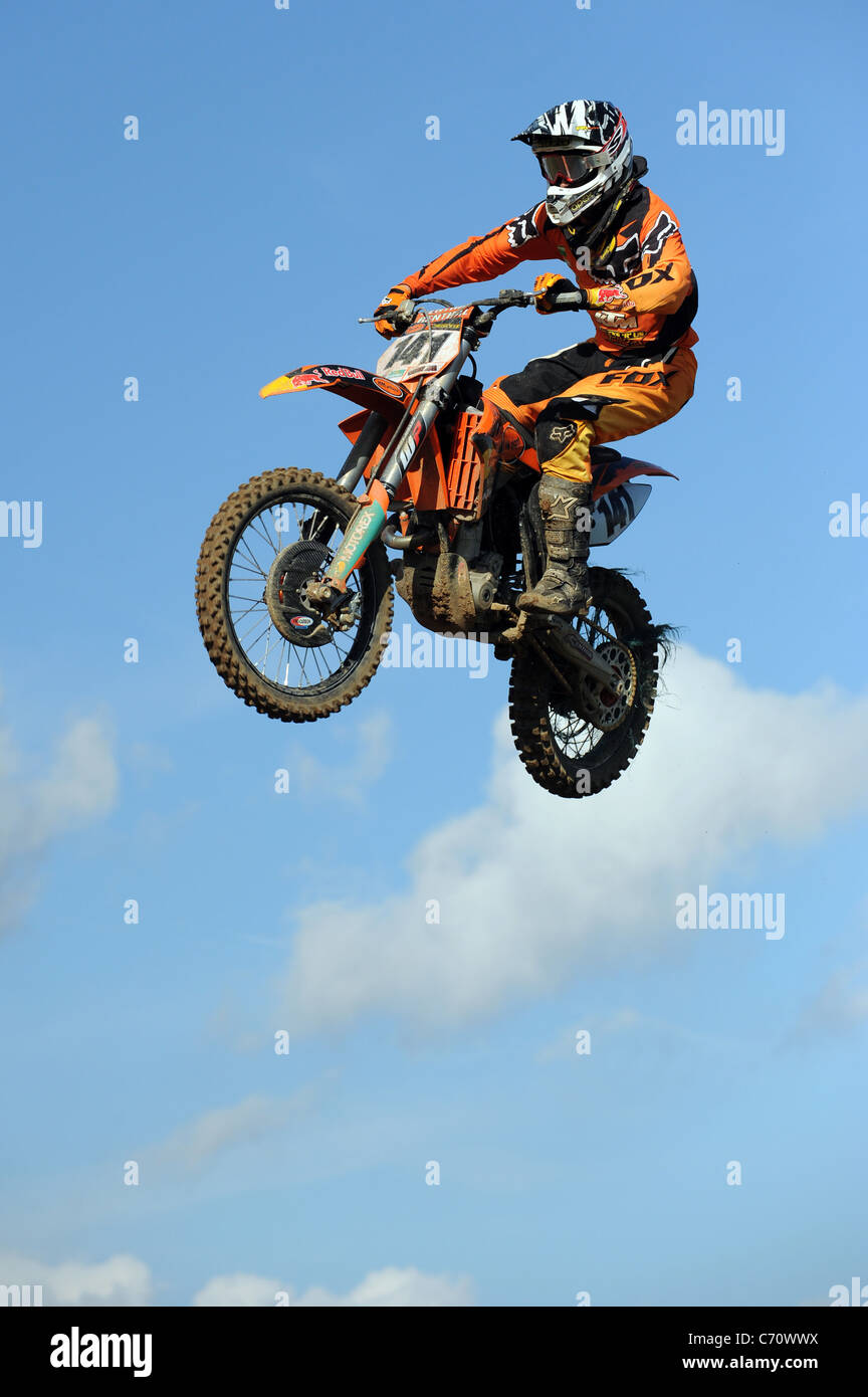 A Motocross Rider jumps through the air on an MX Bike Stock Photo - Alamy