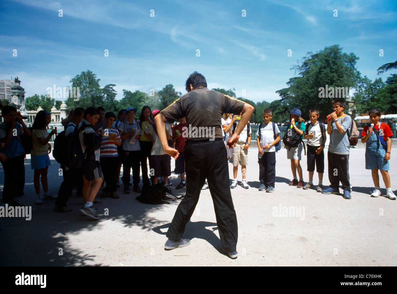 Madrid Spain Retiro Park School Children Watching A Street Entertainer ...