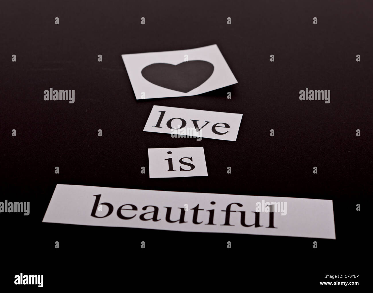 The words Love is beautiful on a black background Stock Photo - Alamy