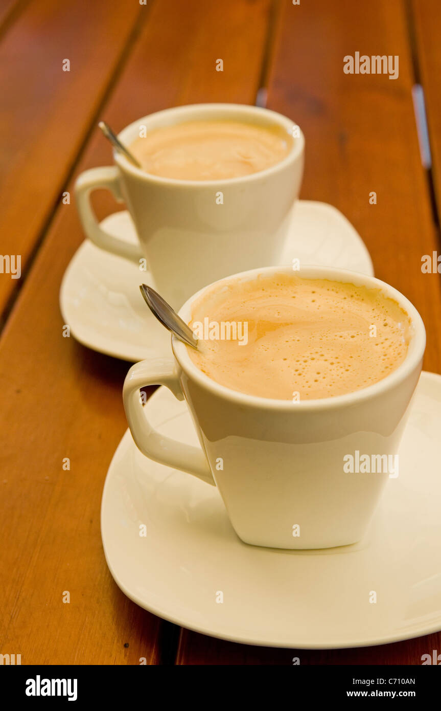 Two white cup cream hi-res stock photography and images - Alamy