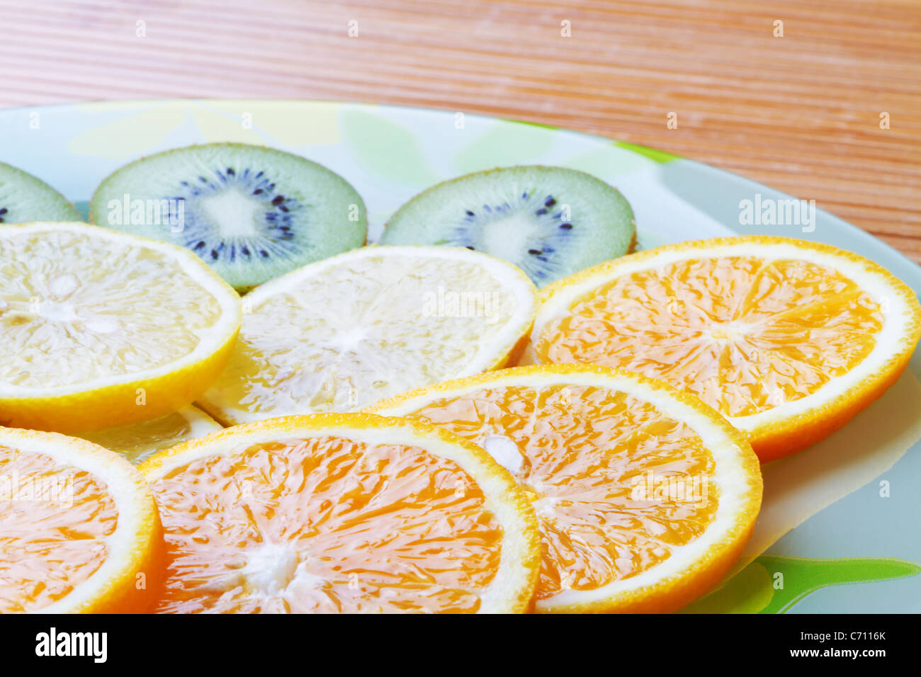 Tropical fruit cut by rings on a plate Stock Photo - Alamy