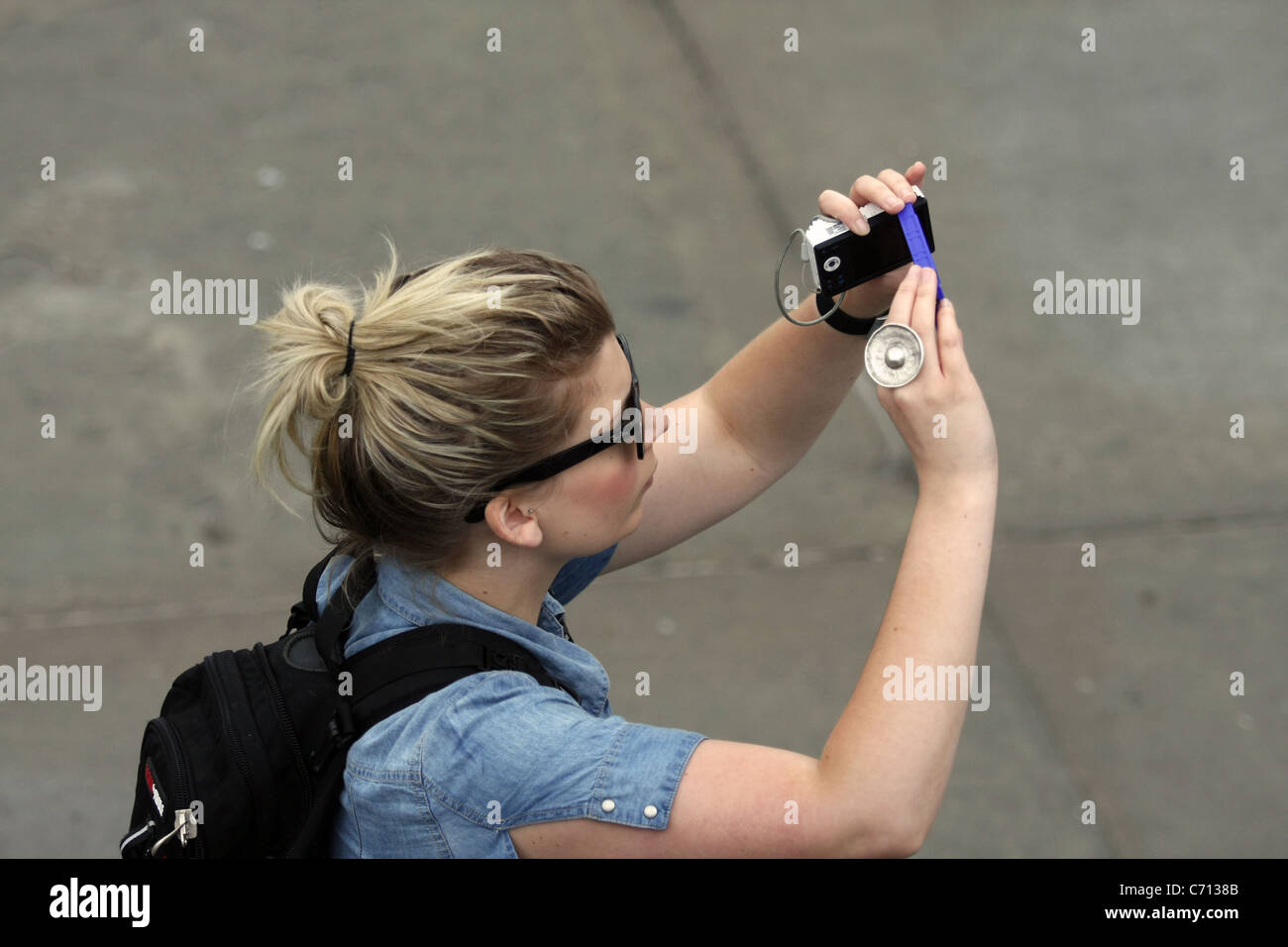 a young lady taking a photograph Stock Photo - Alamy
