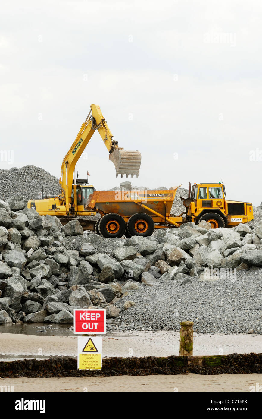 Machinery constructing sea defences at Borth, Ceredigion, Wales Stock ...