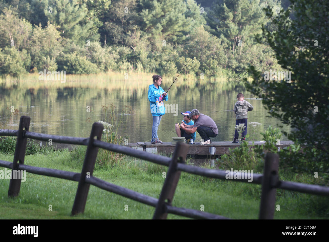 Boys fish pond in hi-res stock photography and images - Alamy