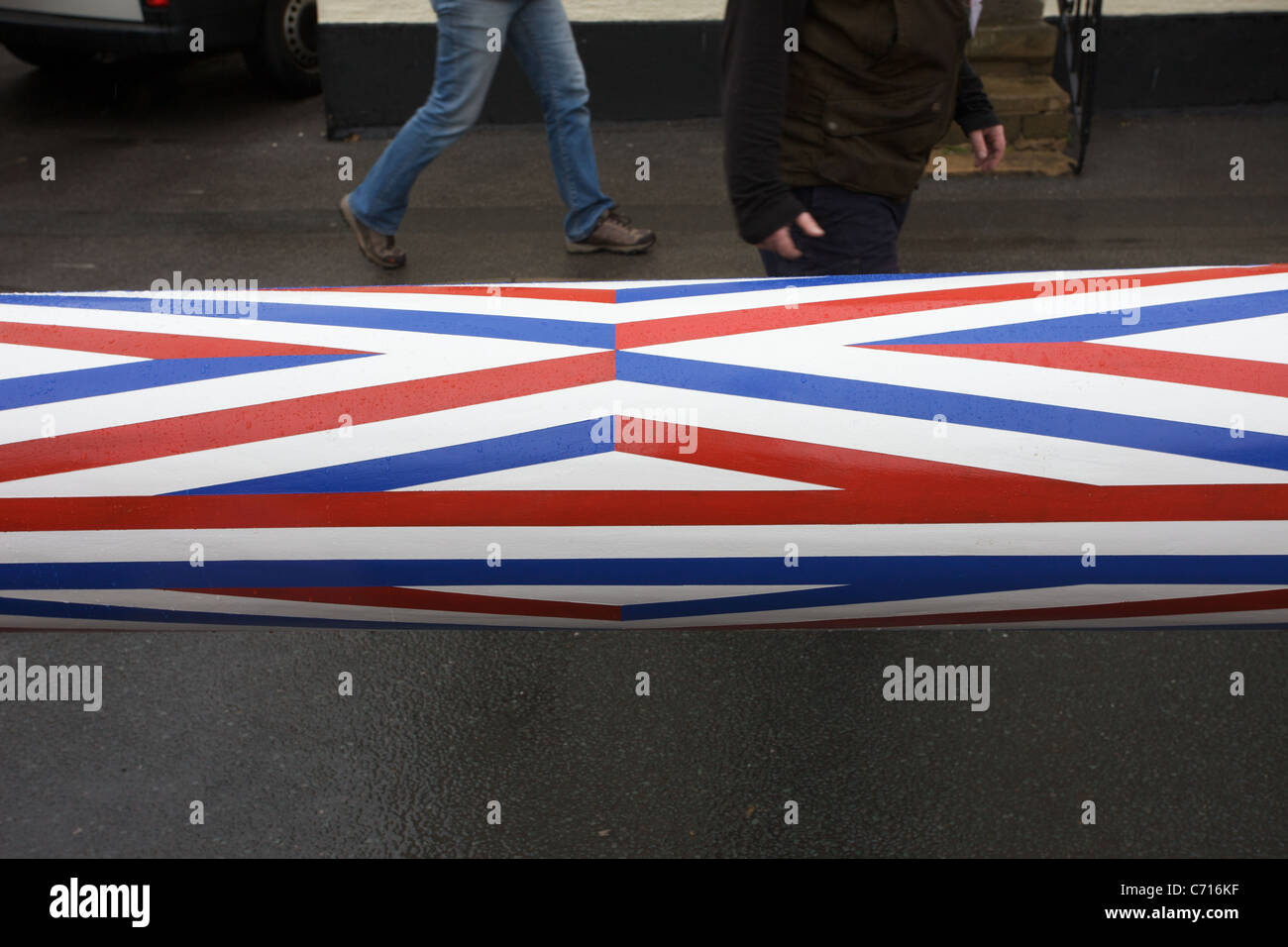 The newly decorated Maypole being put back into position at the center ...
