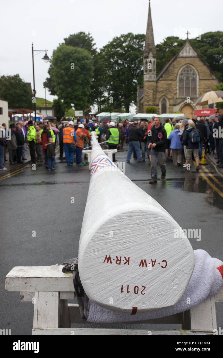 The newly decorated Maypole being put back into position at the center ...
