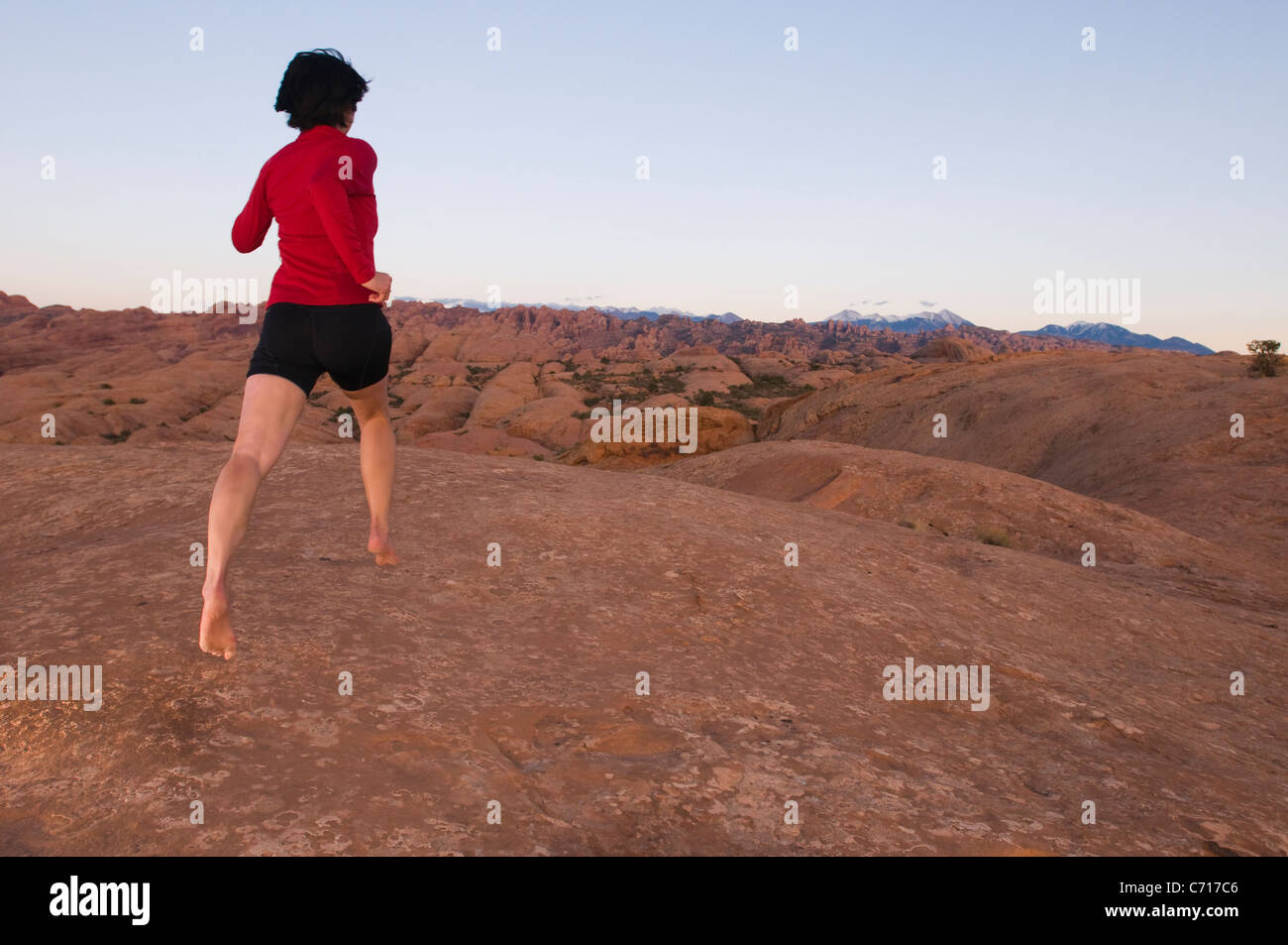 Man barefoot running on sandstone, Moab, Utah Stock Photo - Alamy