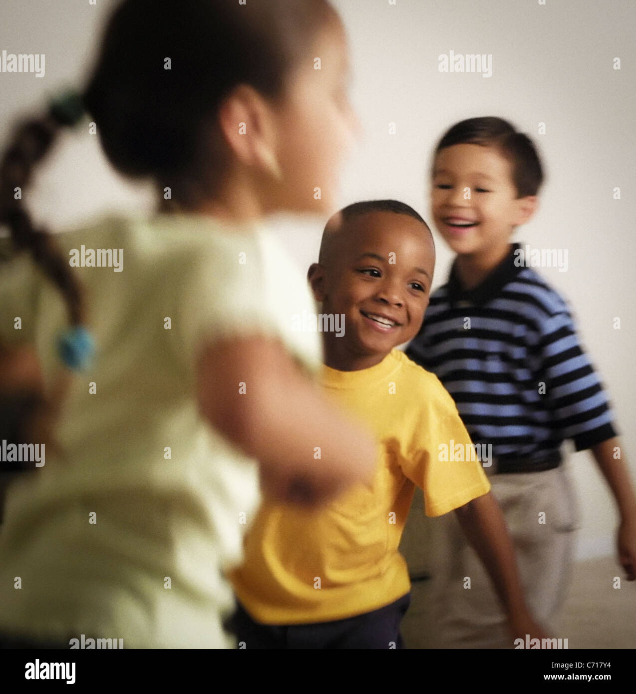 Playful children smiling and playing Stock Photo - Alamy