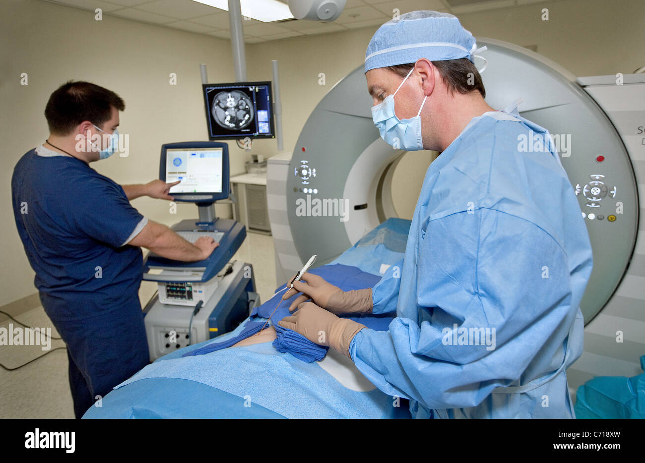 Radiologist and tech in CAT scan room in hospital Stock Photo - Alamy