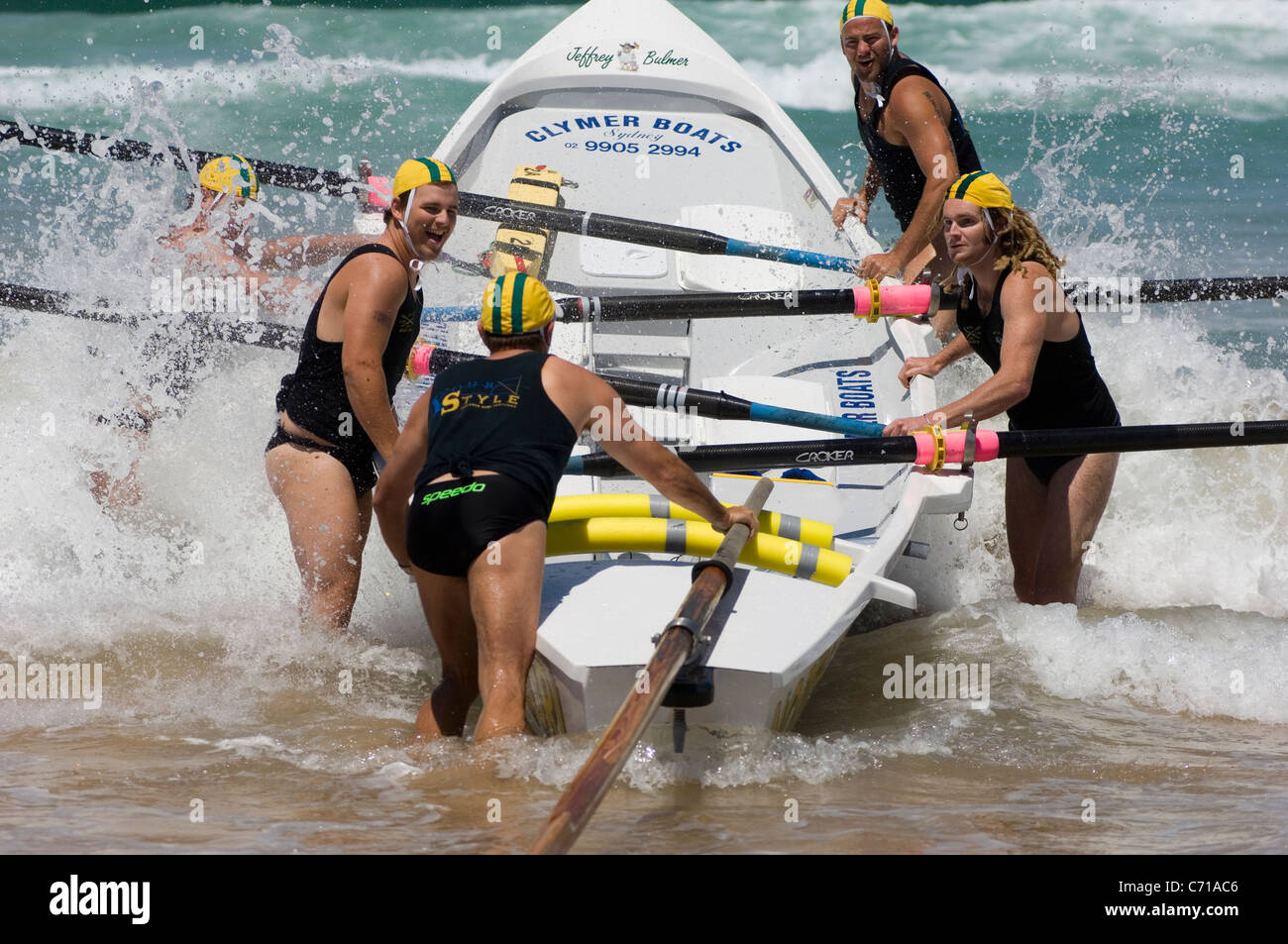 The crew of the North Curl Curl surf rescue boat try to steady their ...