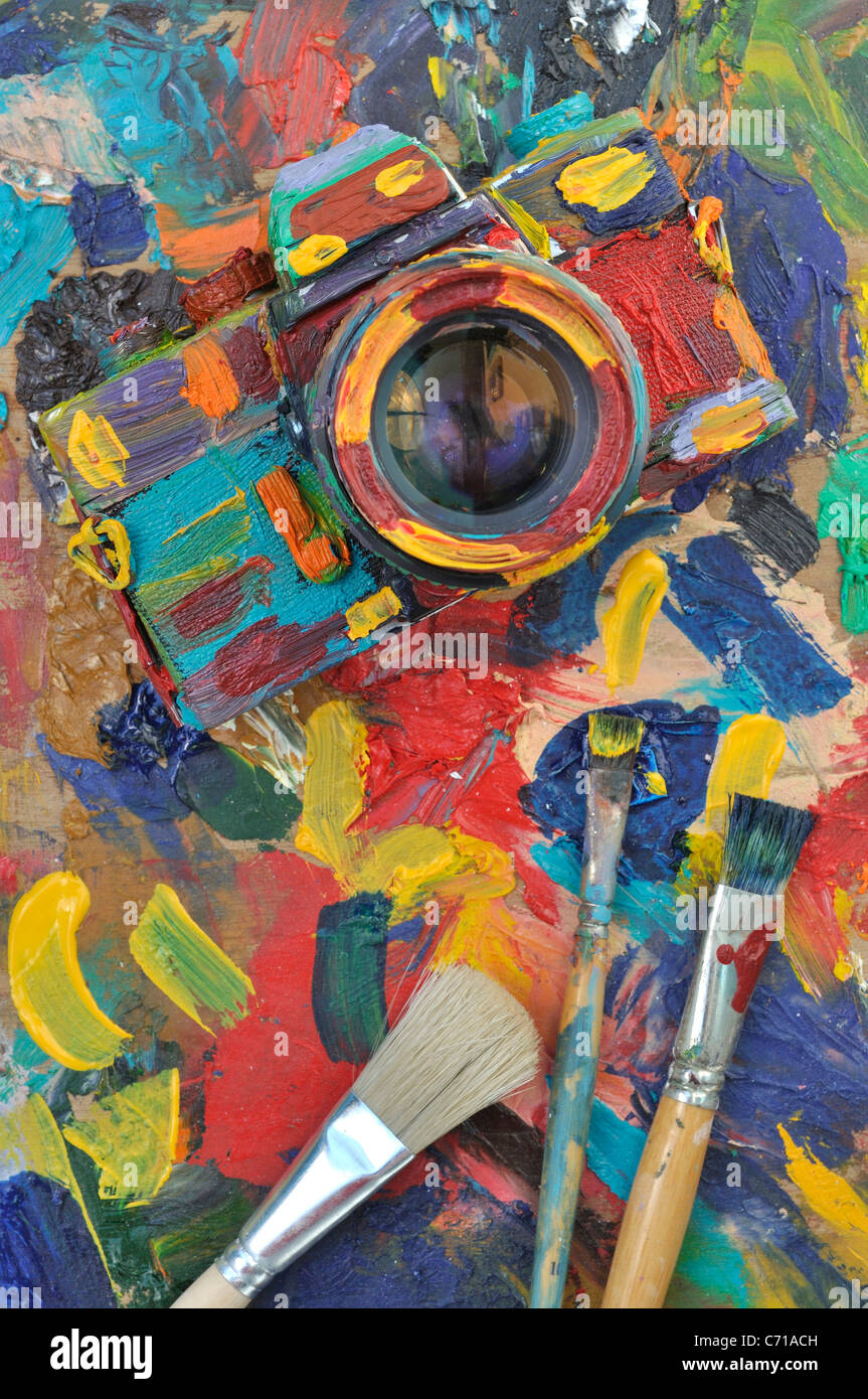 colorful painted SLR photograph camera on the palette Stock Photo - Alamy