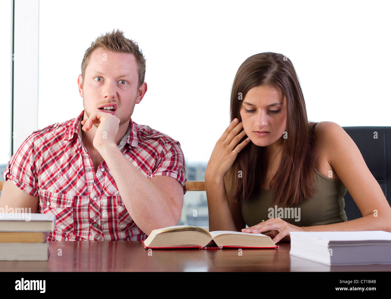 Two students studying in the library Stock Photo - Alamy