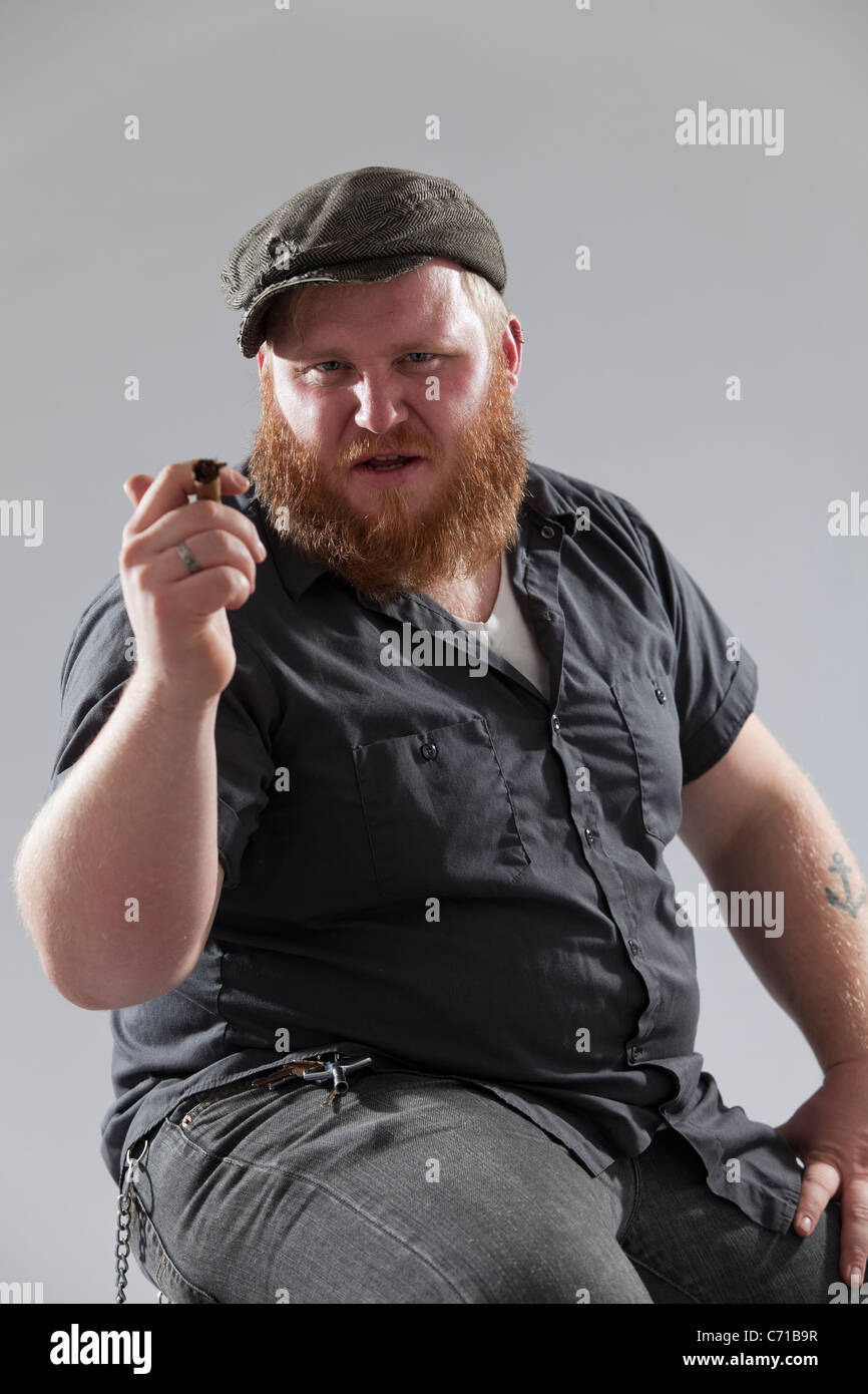 Portrait of a man as a rough-around-the-edges character Stock Photo - Alamy