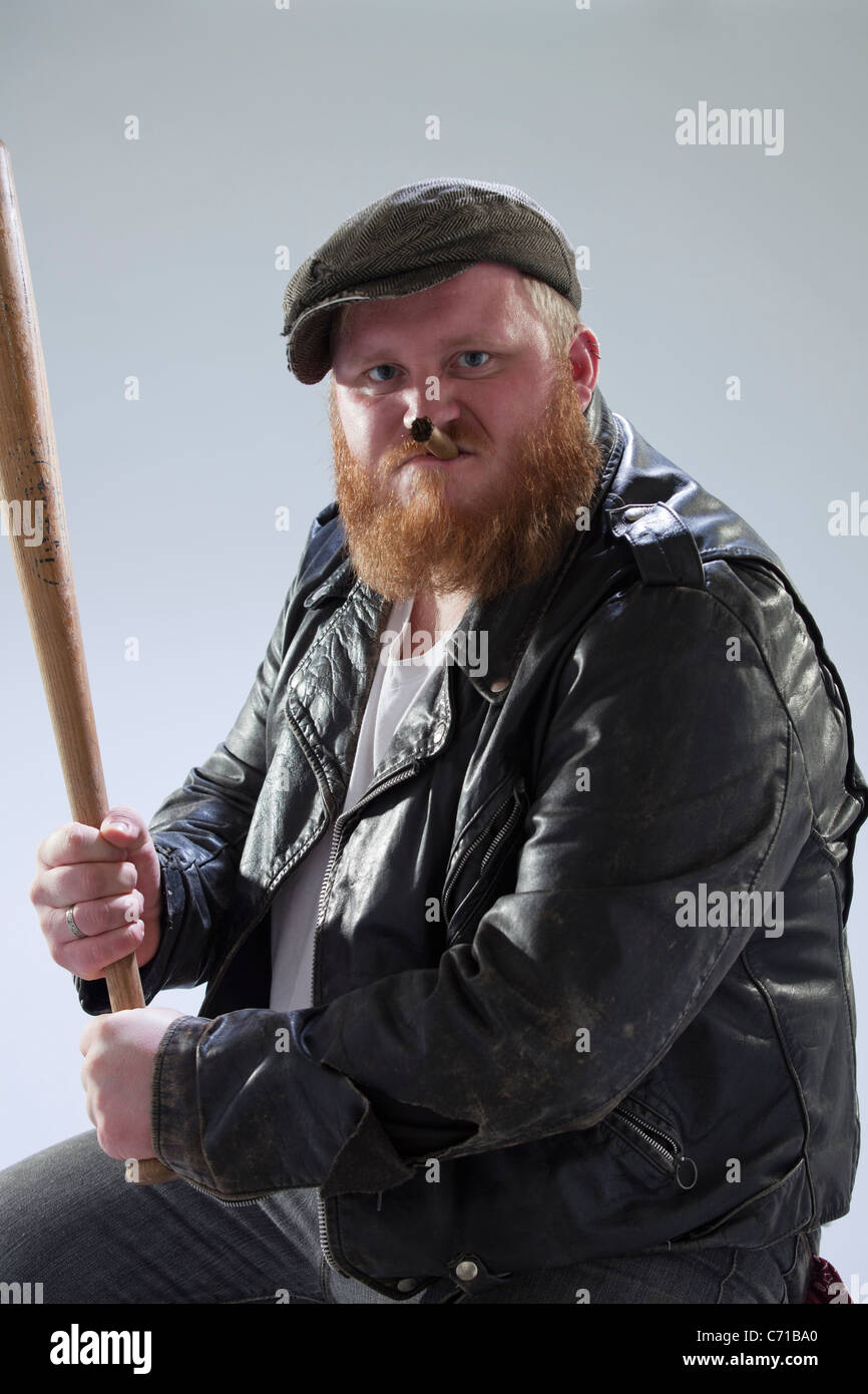 Portrait of a man as a rough-around-the-edges character Stock Photo - Alamy