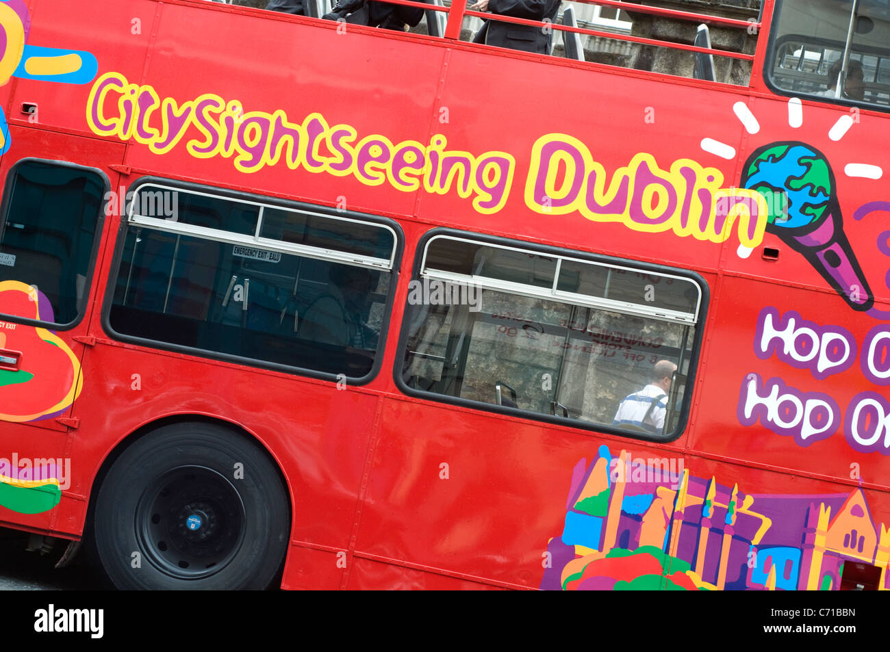 A red double decker tour bus in Dublin, Ireland Stock Photo - Alamy