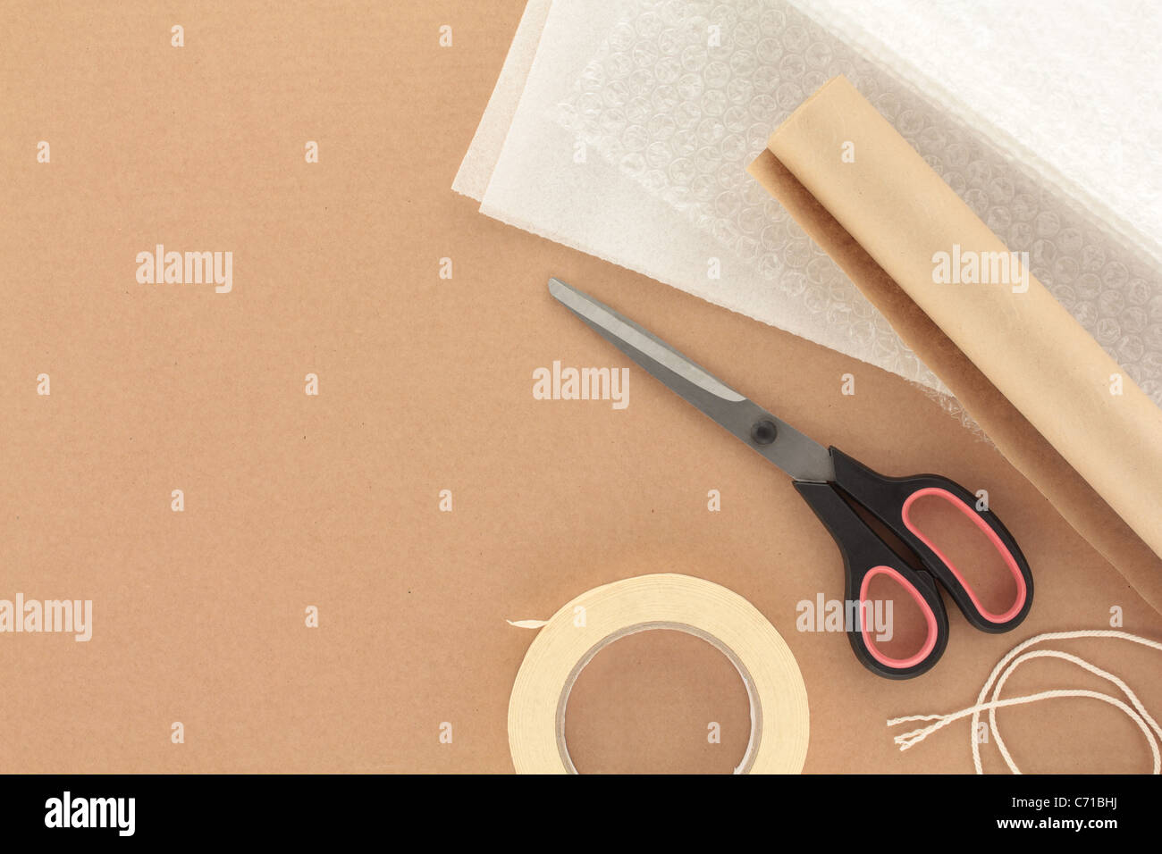 Packaging Materials with Scissors Stock Photo - Alamy