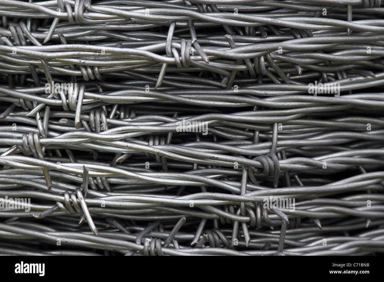 Barbed wire background Stock Photo - Alamy