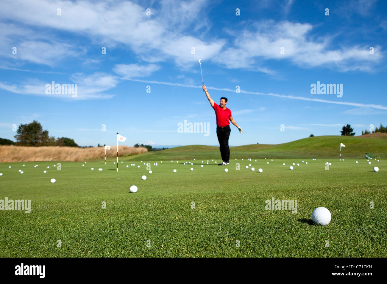 Man excited about making a putt while golfing Stock Photo - Alamy