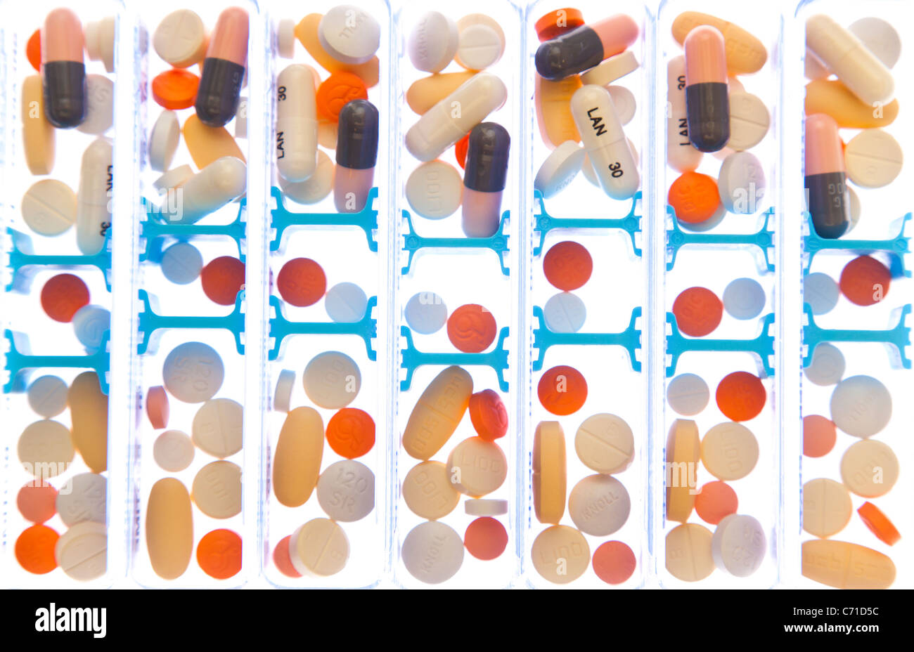Medication tablets in a seven day organiser Stock Photo - Alamy