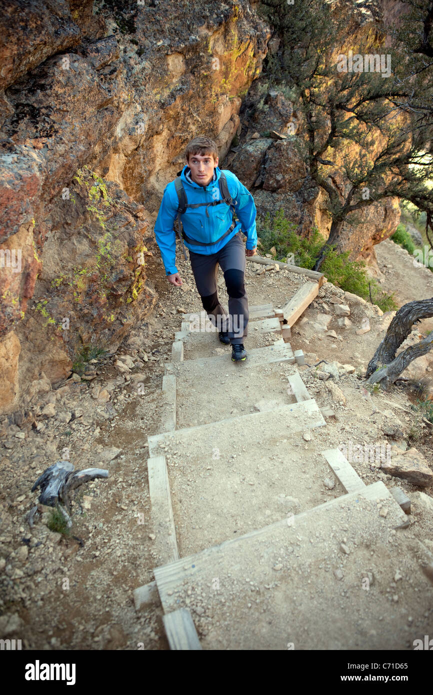 Male hiking steps of rocky path Stock Photo - Alamy
