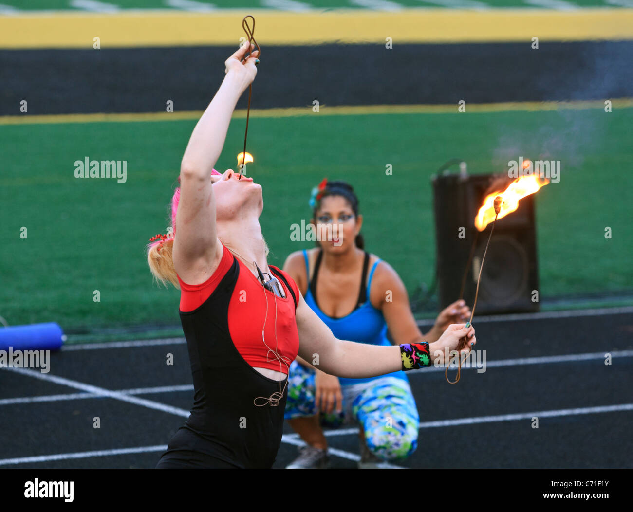 Woman demonstrating fire-eating Stock Photo - Alamy