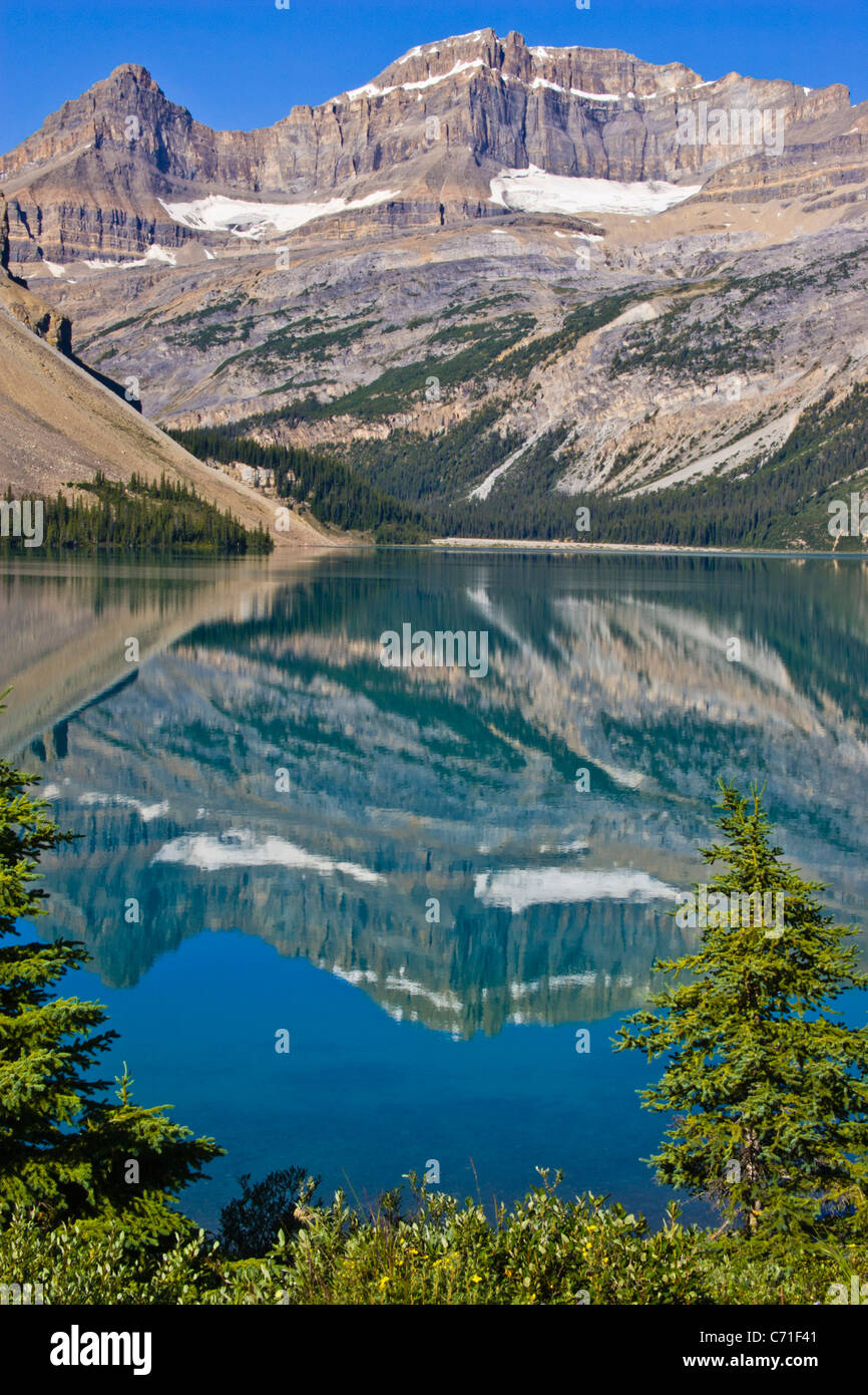 Mirror image reflections in Bow Lake in Banff National Park in Alberta ...