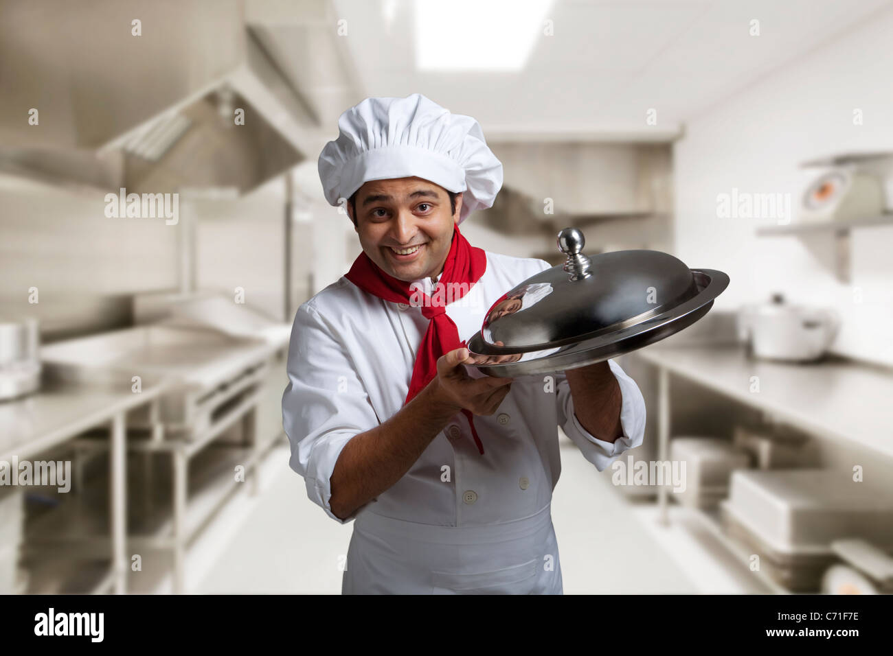 Chef smiling holding tray hi-res stock photography and images - Alamy