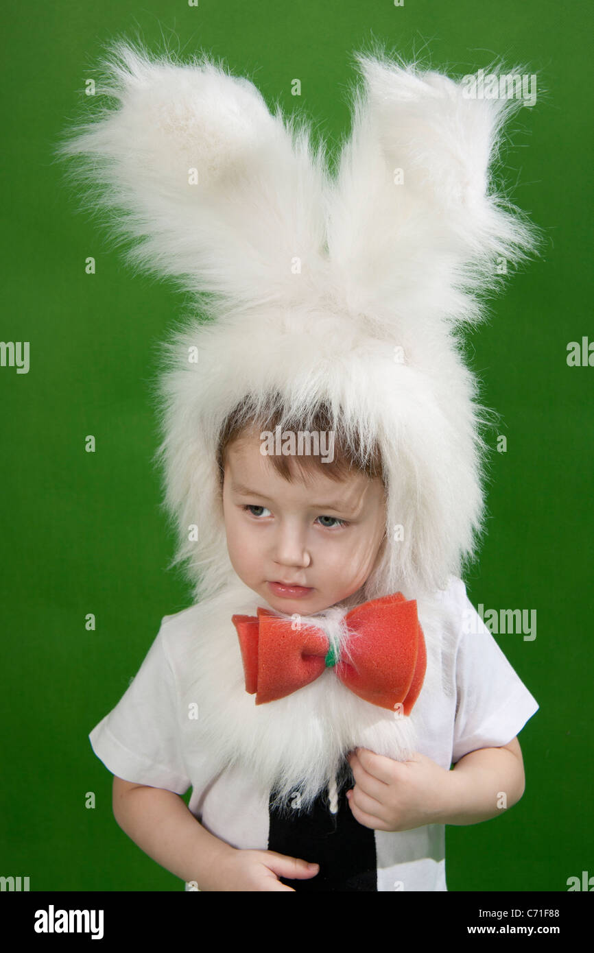 Boy in a white downy bunny costume Stock Photo - Alamy