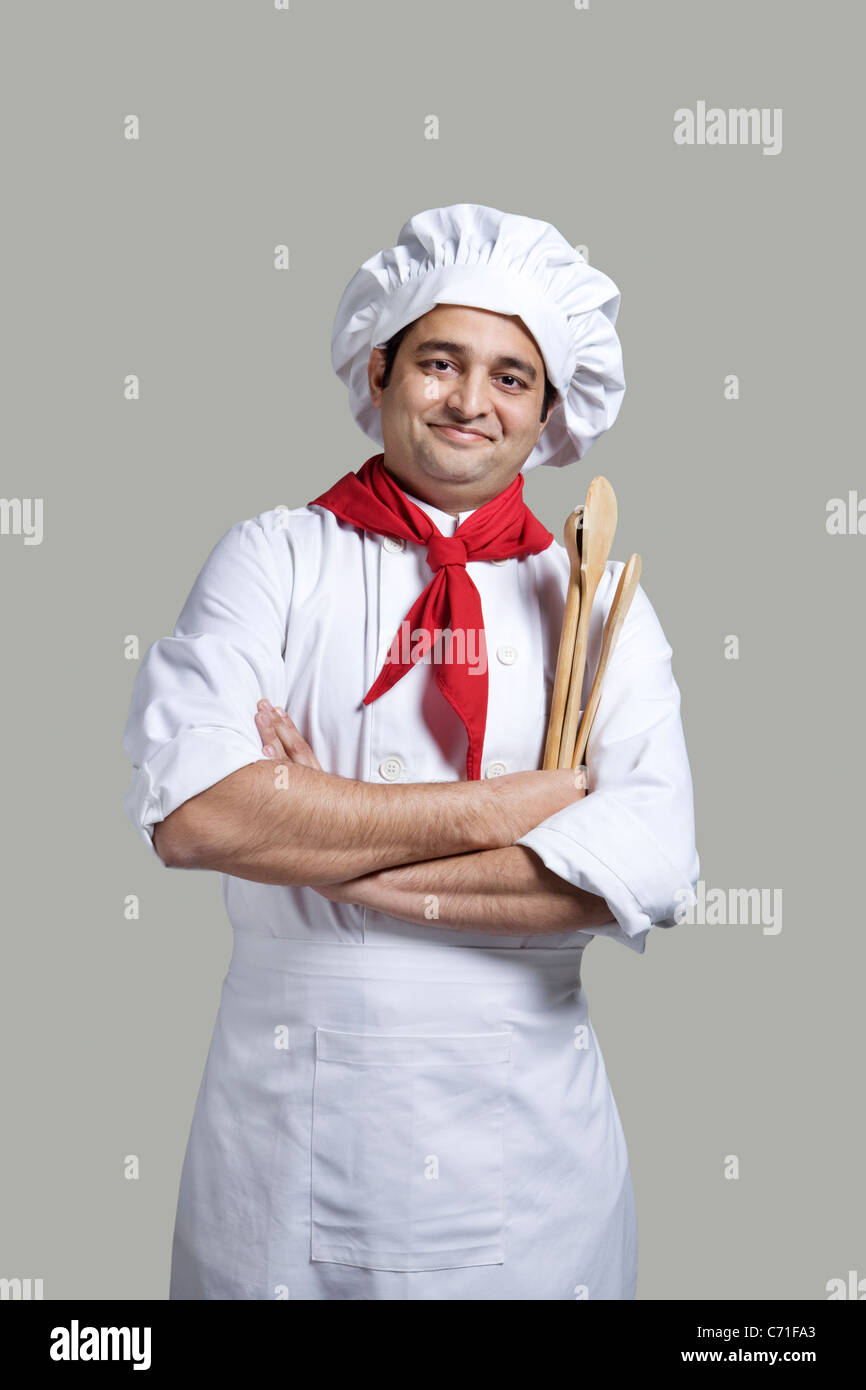 Portrait of a chef with wooden spoons Stock Photo - Alamy