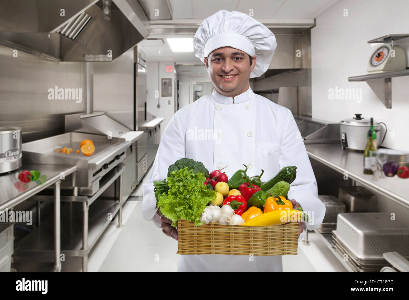 Chef carrying a basket of fresh vegetables Stock Photo - Alamy