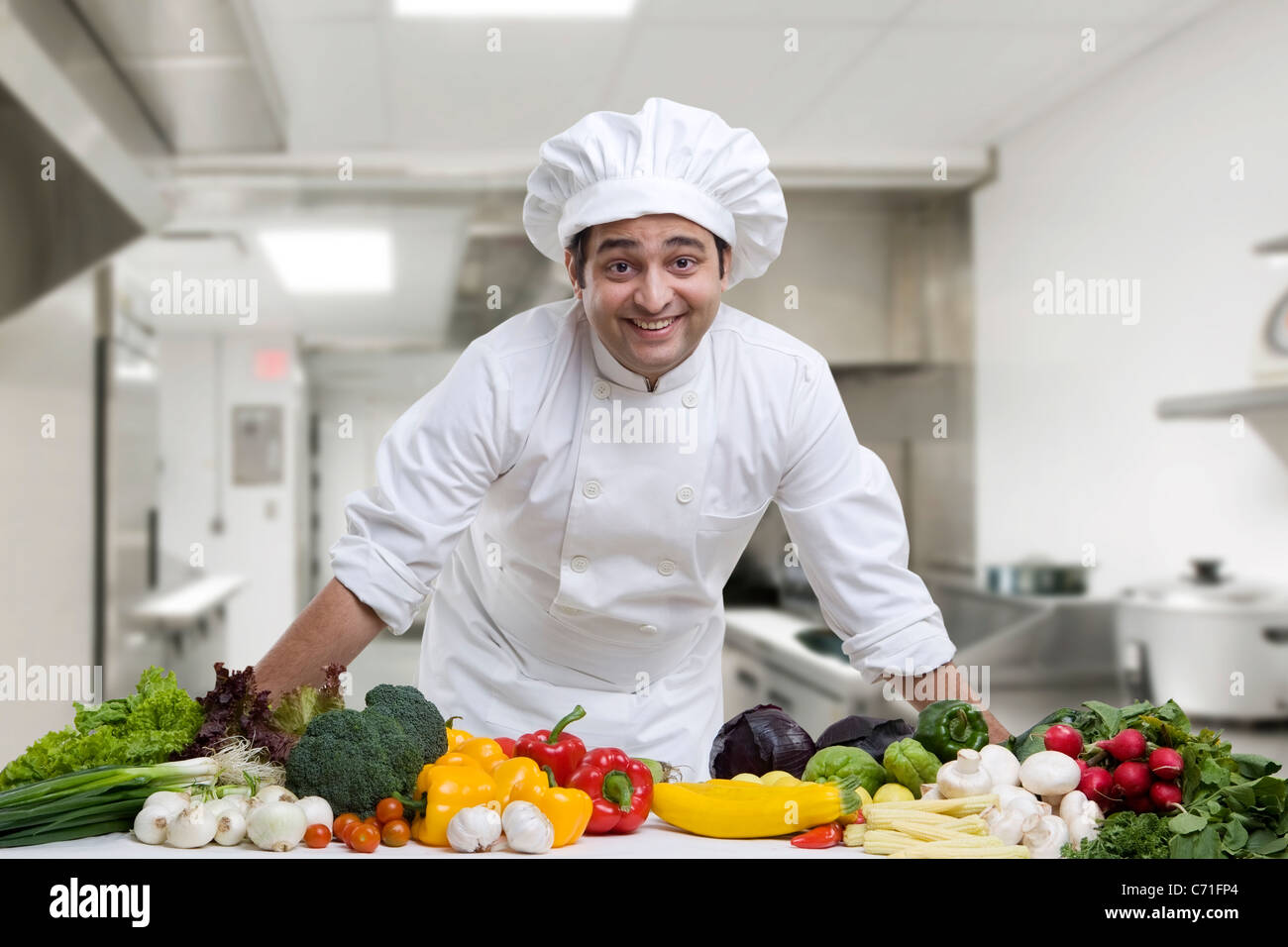Portrait of a chef with his vegetables Stock Photo - Alamy
