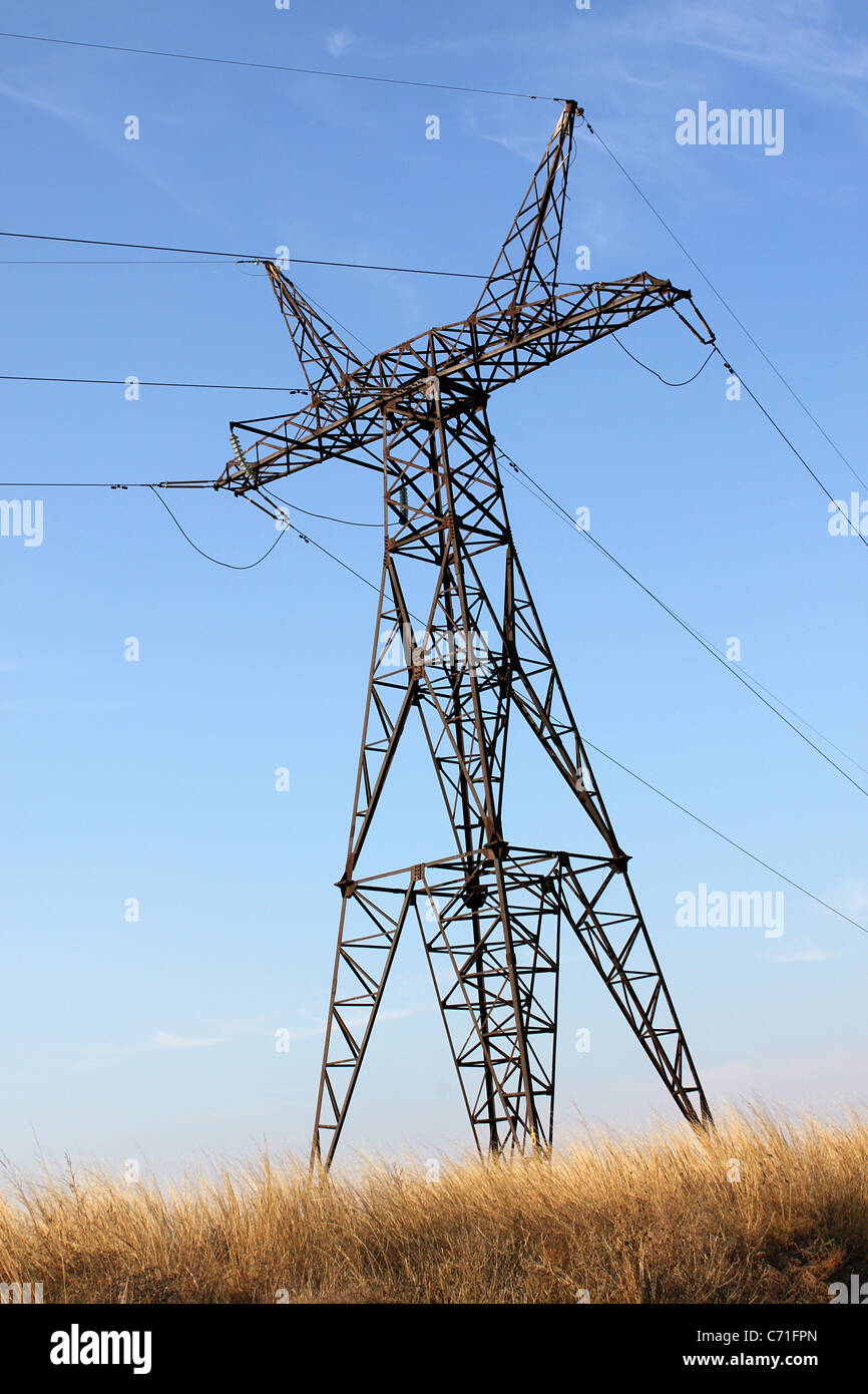 electricity pillar in a field Stock Photo - Alamy