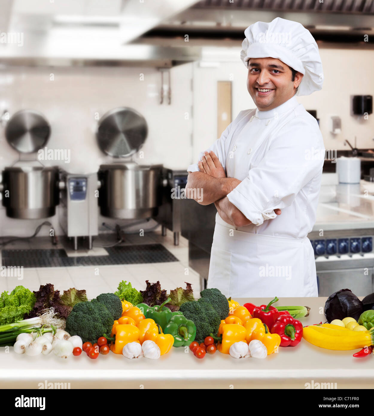 Portrait of a chef with his vegetables Stock Photo - Alamy