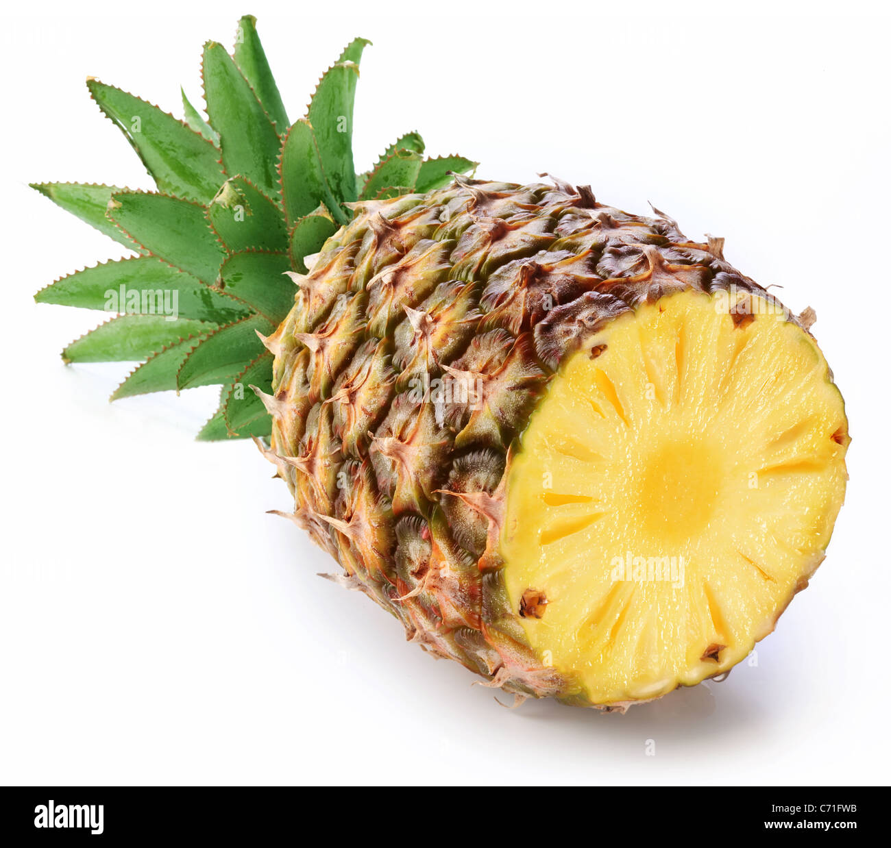 Pineapple cut on a white background Stock Photo - Alamy