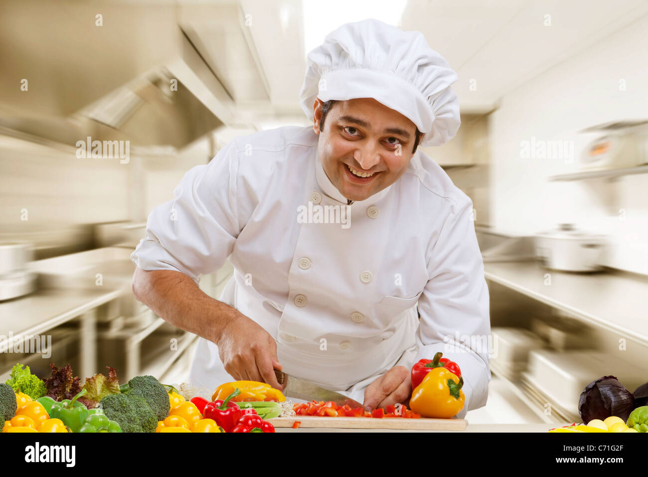 Chef cutting vegetables in the kitchen Stock Photo - Alamy