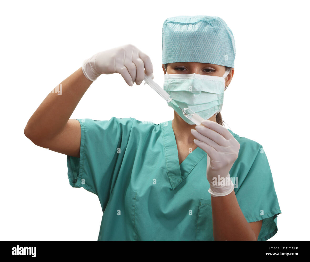 Female nurse filling a syringe with needle with a solution from a vial ...