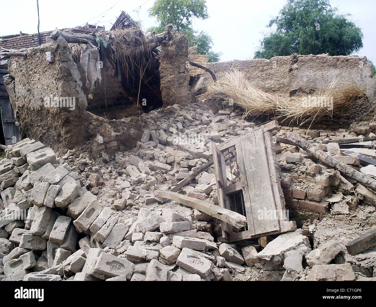 view of destroyed houses at a rain hit area Stock Photo - Alamy