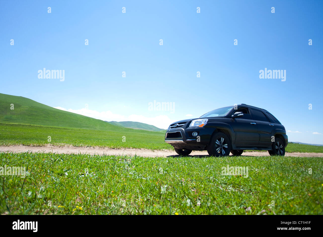 Car parked next to rural road Stock Photo - Alamy