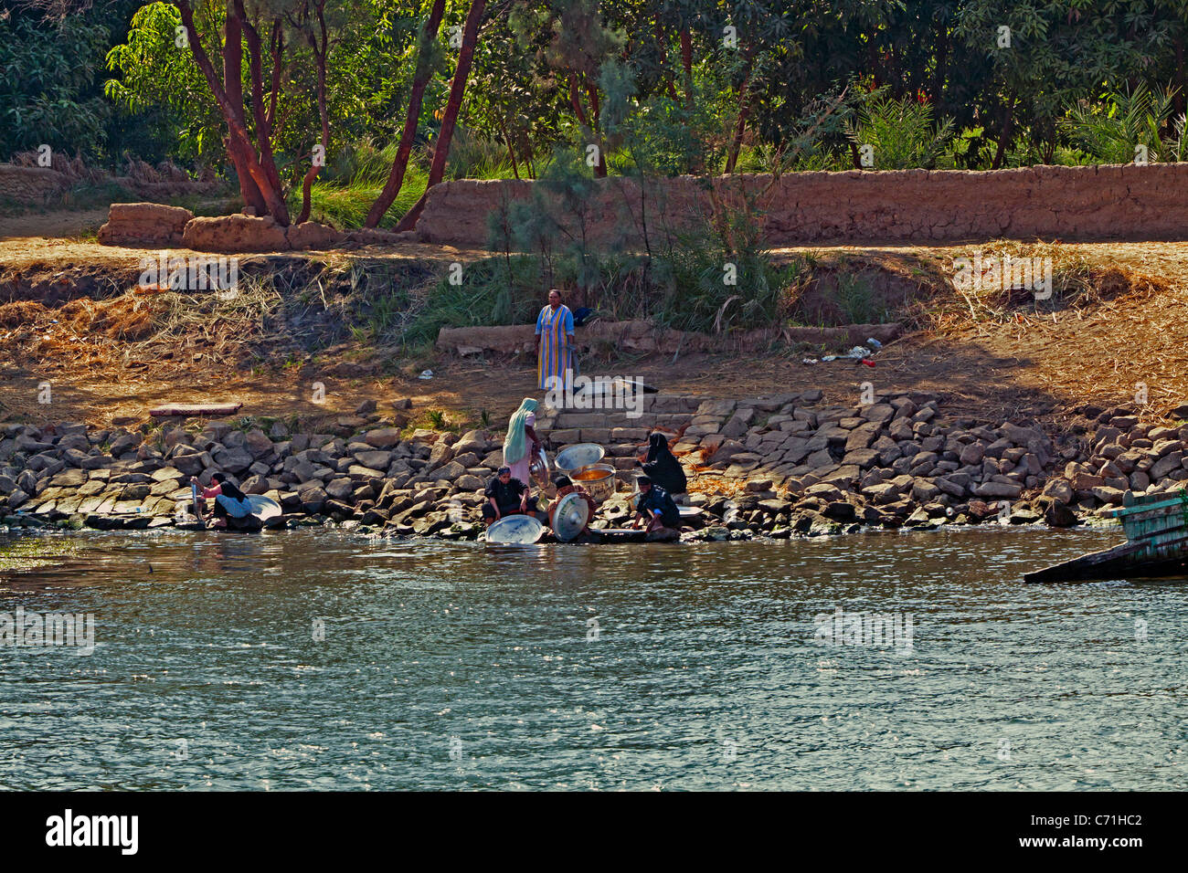 Egyptian women washing their pots and pans on the waters of the River ...