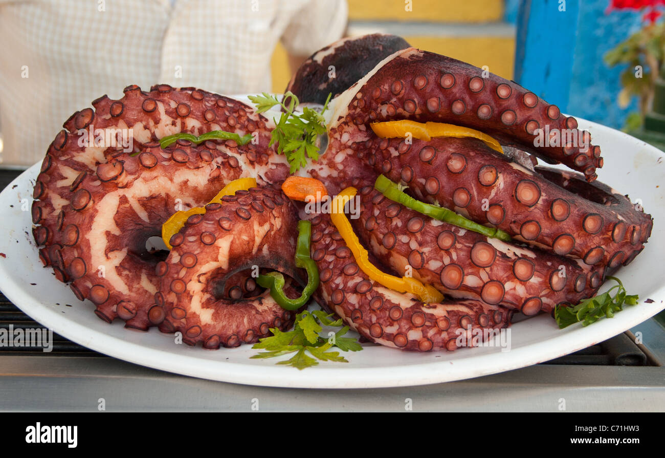 Octopus tentacles on plate Stock Photo - Alamy