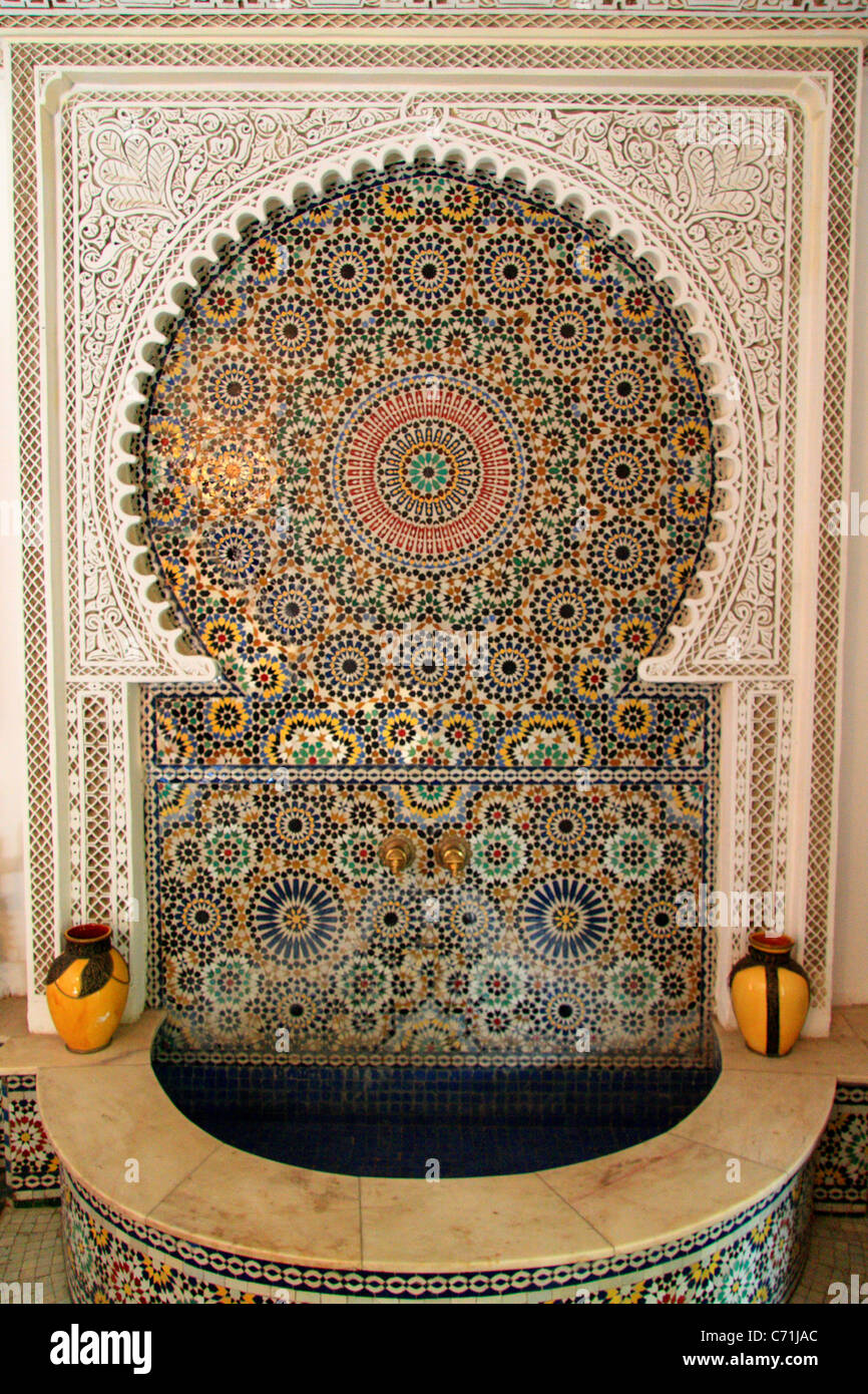 Water fountain with mosaic tilework and stucco design, Morocco, North ...