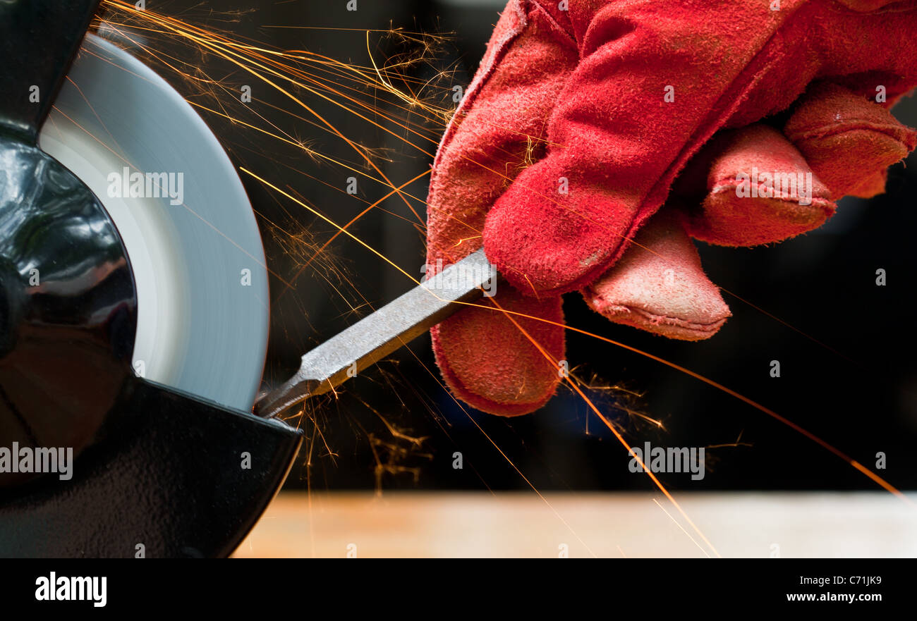 grinding metal on a bench grinder Stock Photo - Alamy