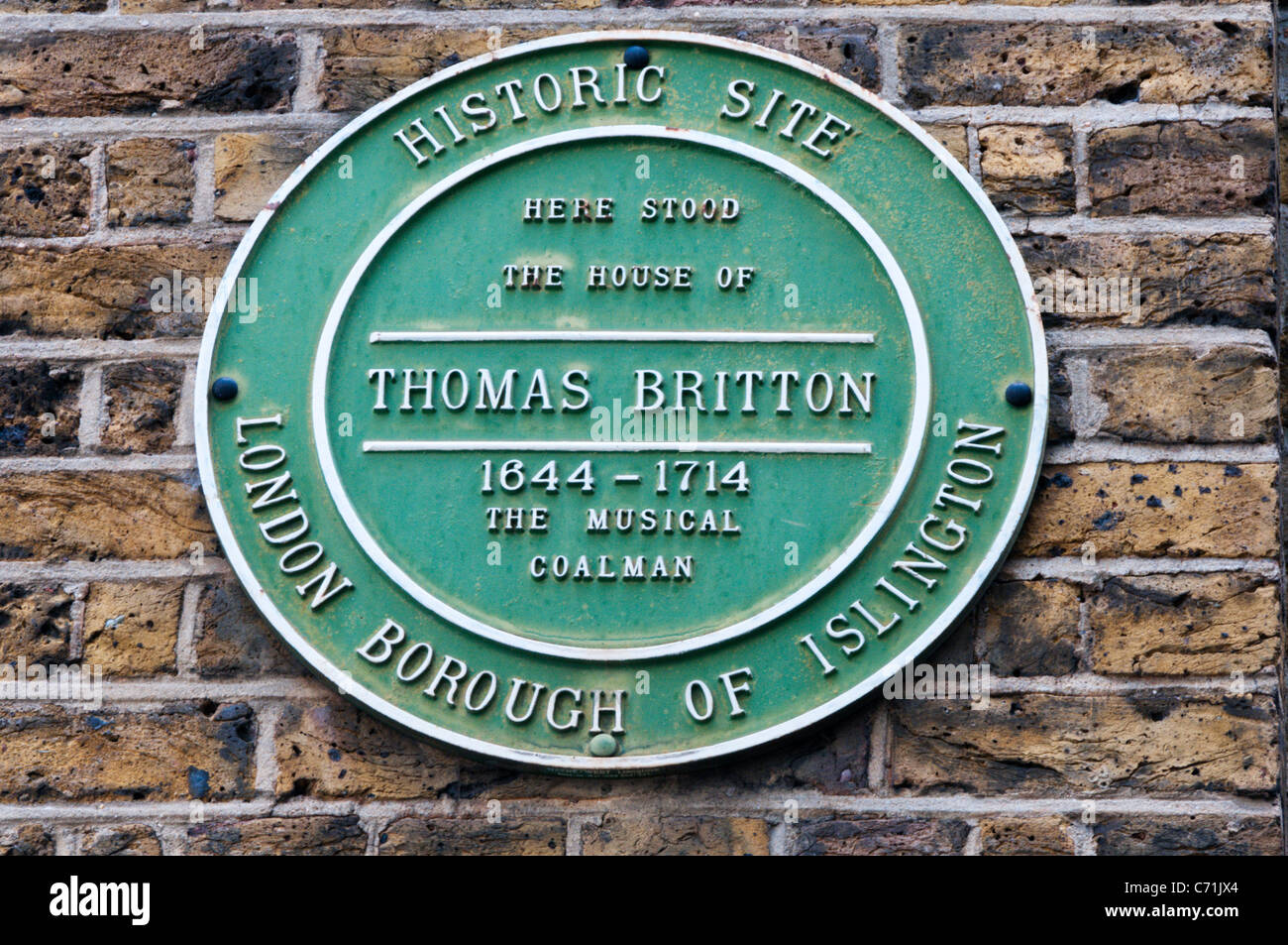A green plaque marking the site of the house of Thomas Britton, the ...