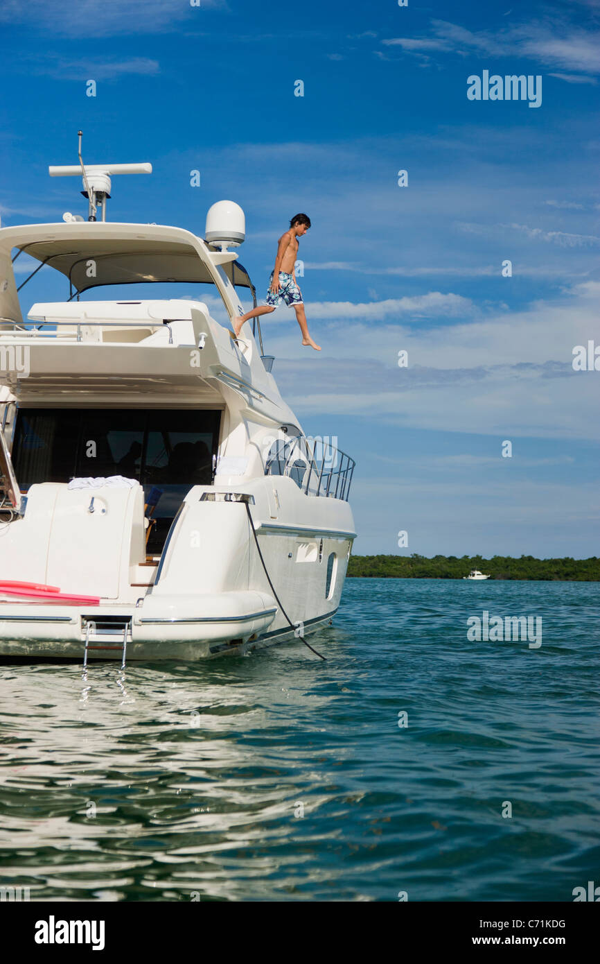 Person jumping from boat hi-res stock photography and images - Alamy