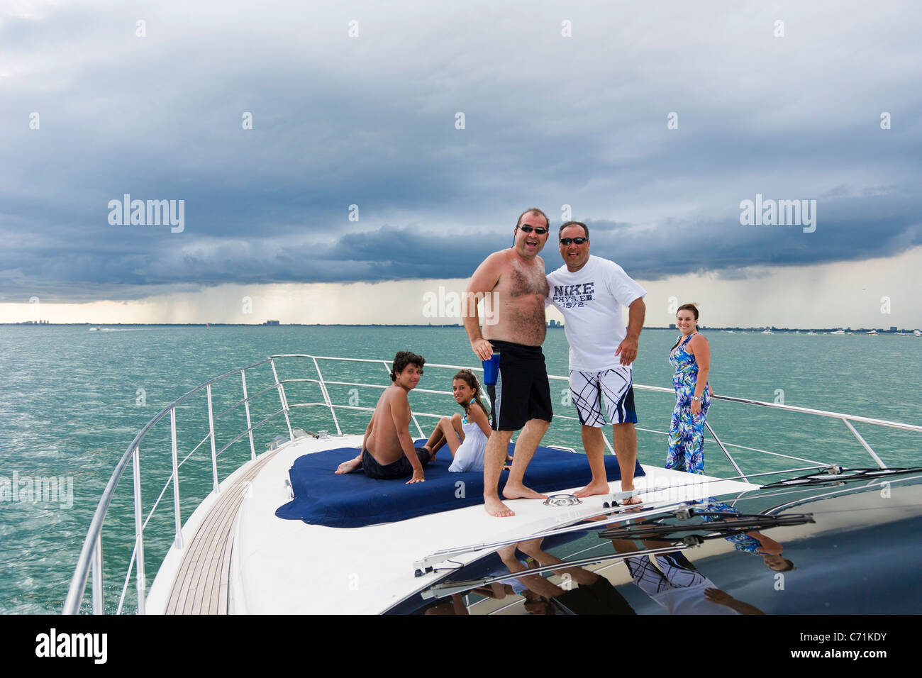 Group of people on boat deck, smiling portrait Stock Photo - Alamy