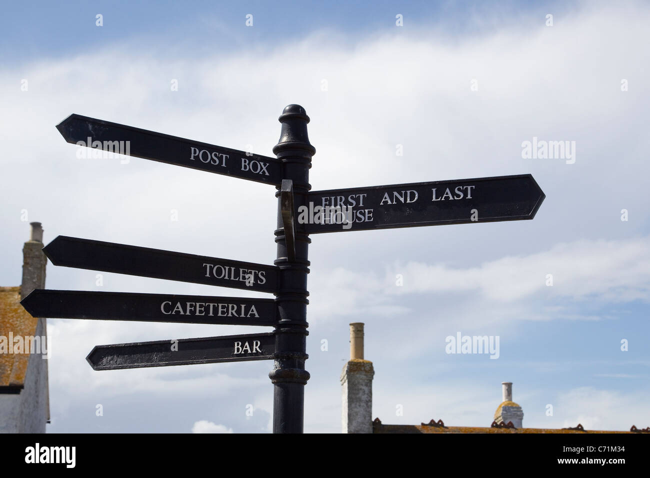 First and Last House signpost at Land's End Cornwall Stock Photo - Alamy