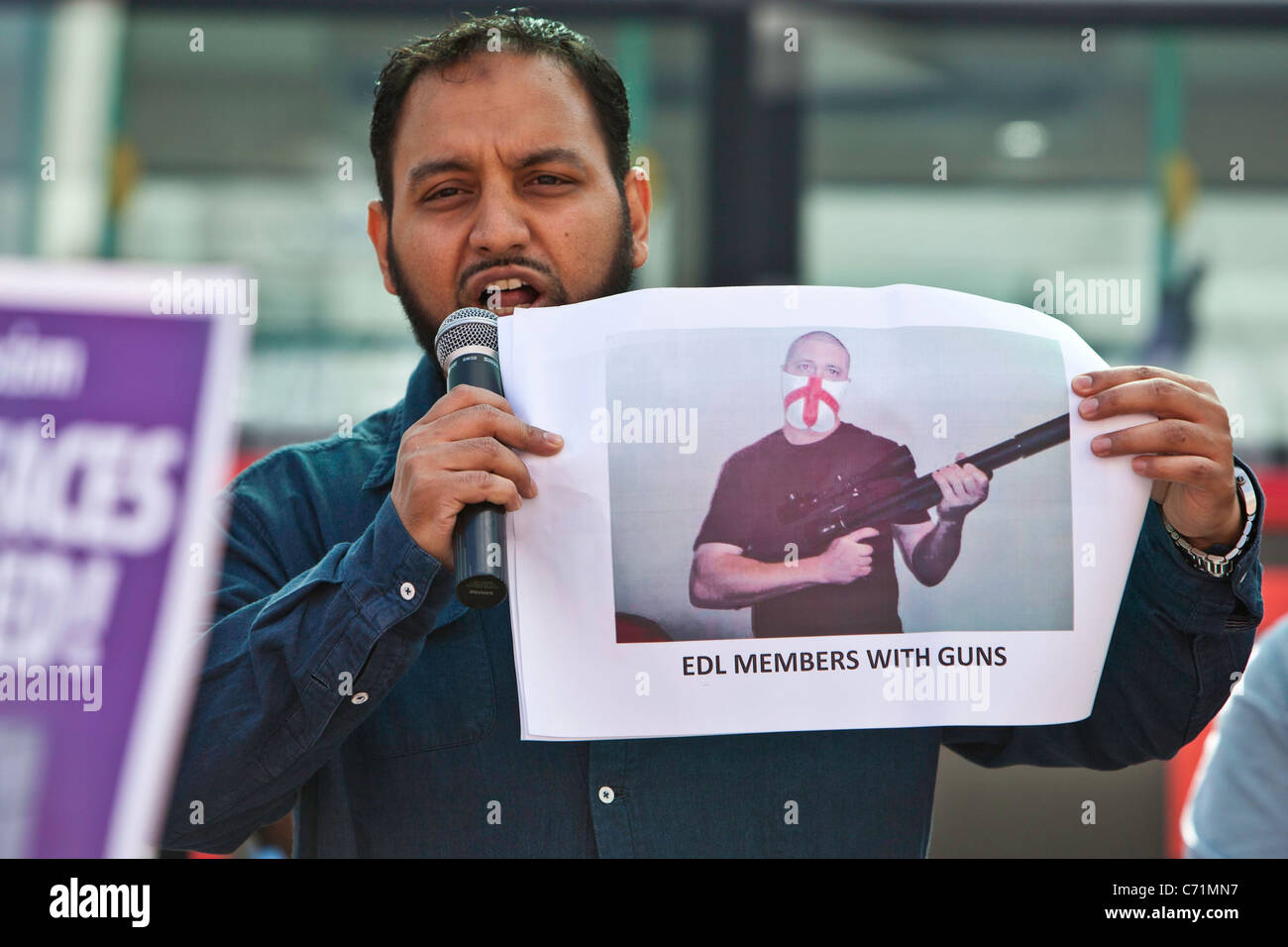 East London Mosque’s Dilowar Khan hold up images of the EDL with guns ...