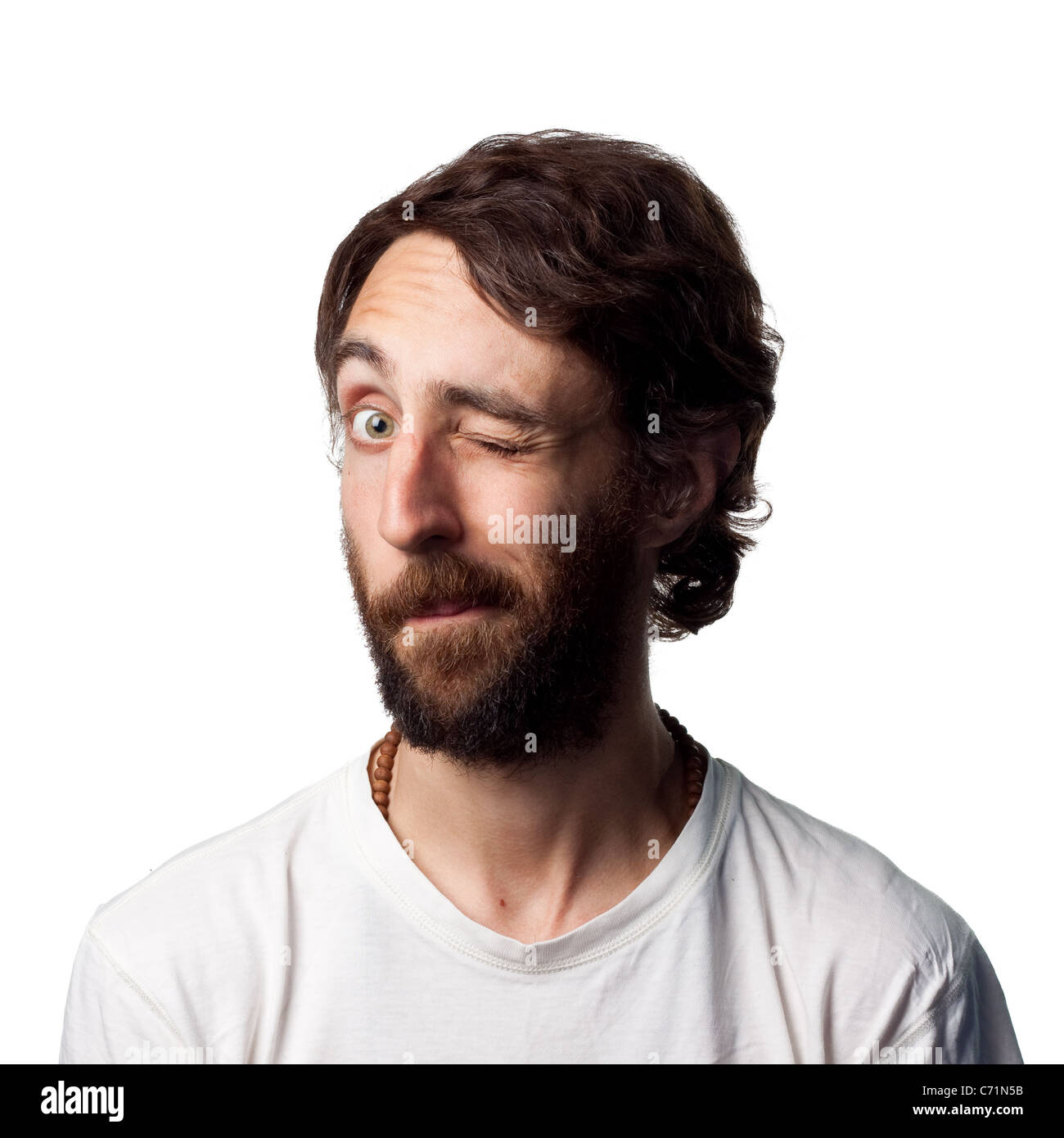 Young man winking to camera Stock Photo - Alamy