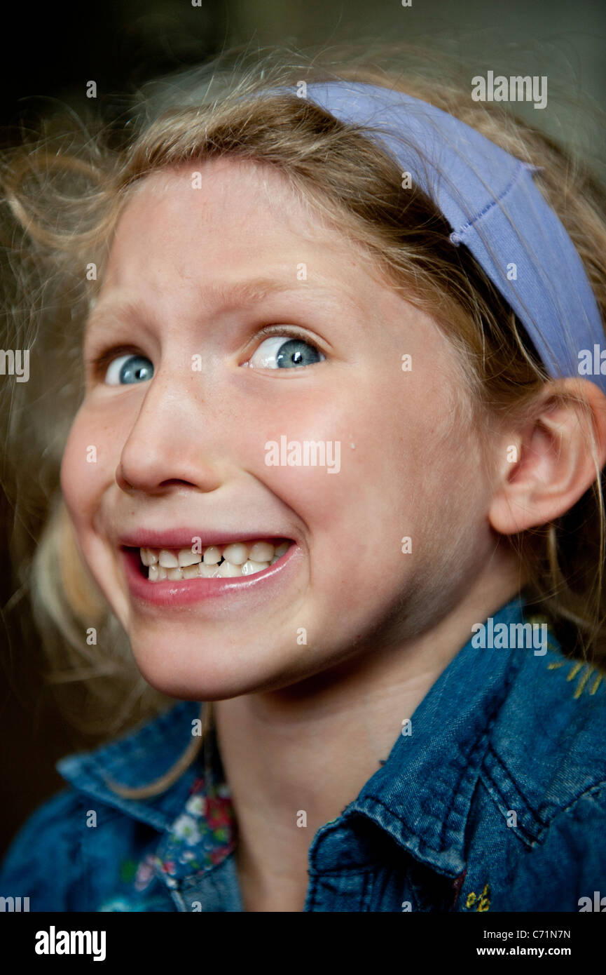 young girl makes silly faces for the camera Stock Photo - Alamy