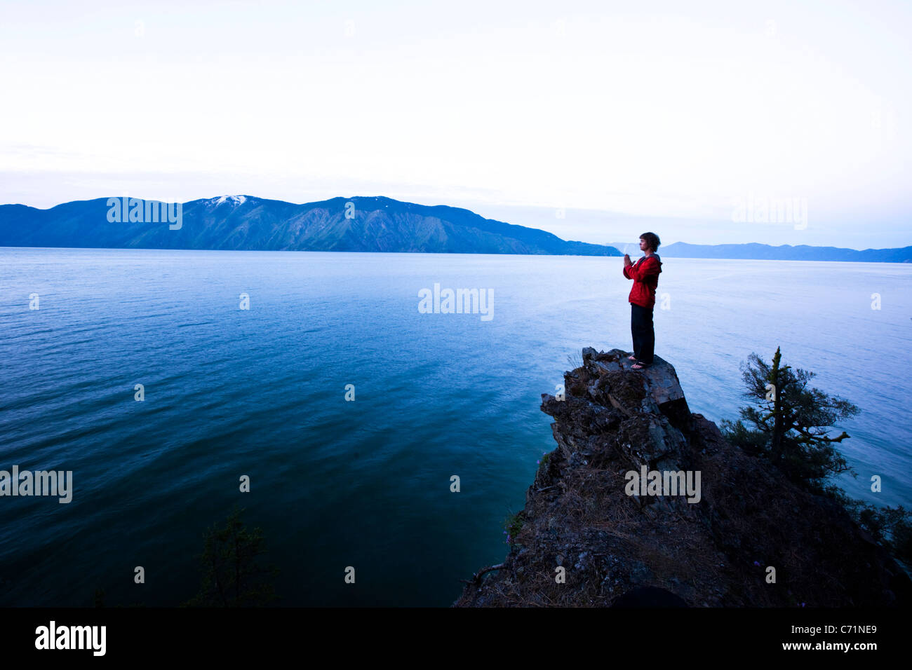 Person on a cliff watching the sunrise hi-res stock photography and ...